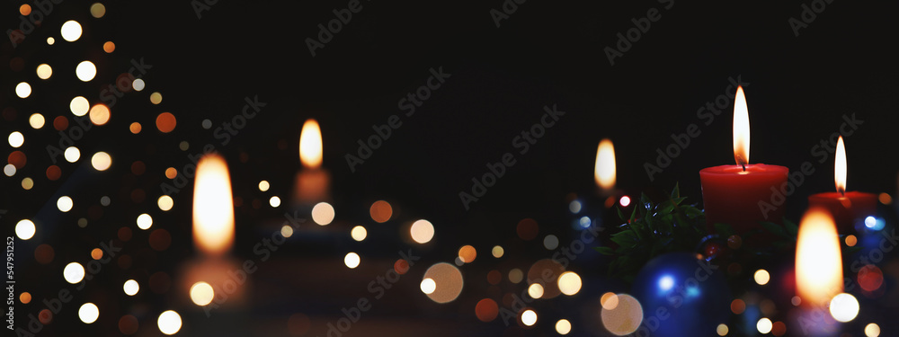 Sparkling church Christmas tree decorations, brightly lit candles and ...