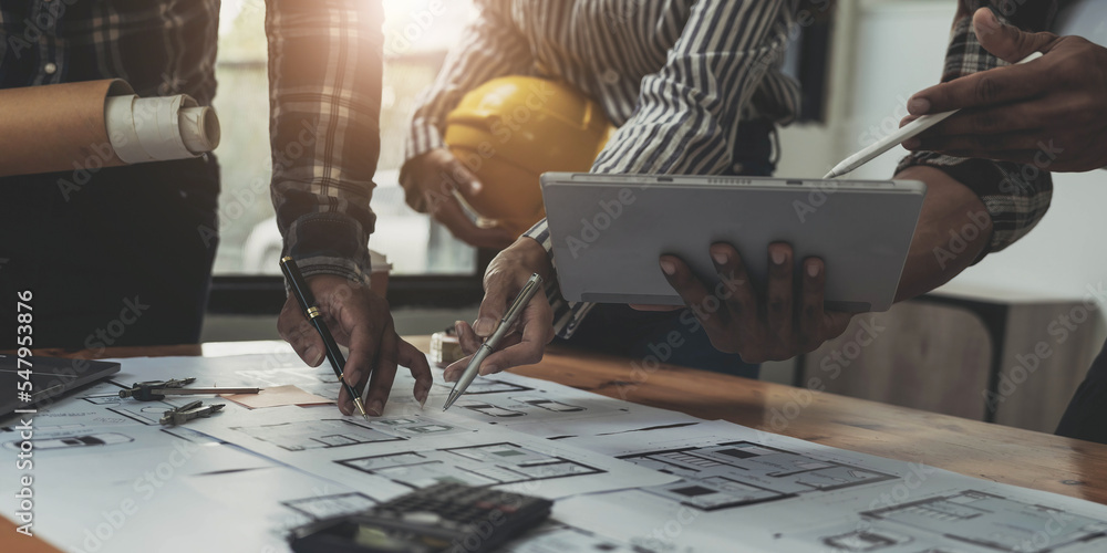 Engineer Teamwork Meeting, Drawing working on blueprint meeting for ...