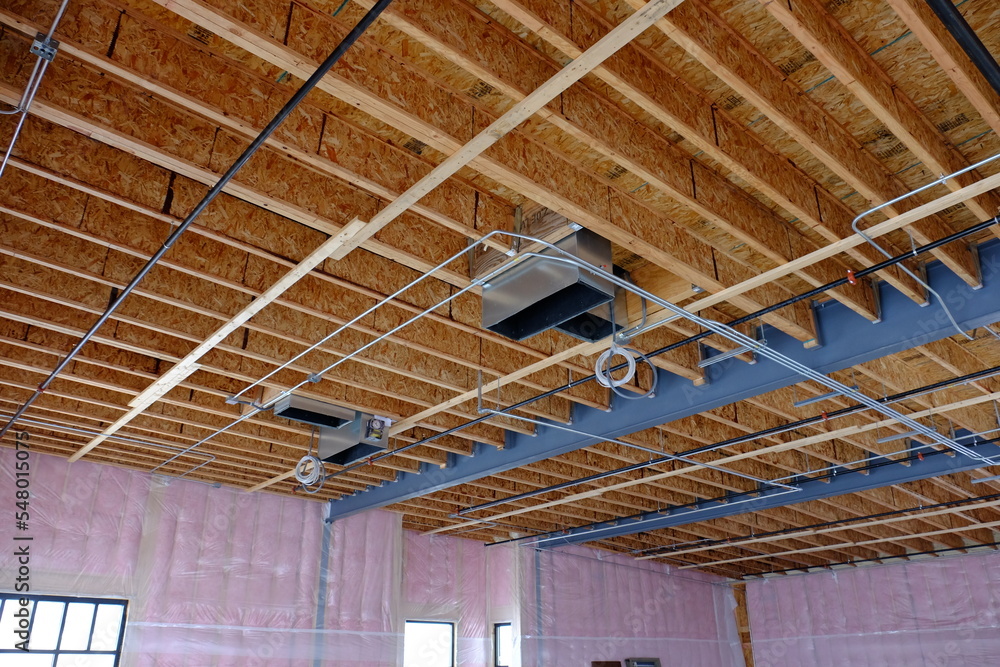 building under construction, trusses and duct drops Stock Photo | Adobe ...