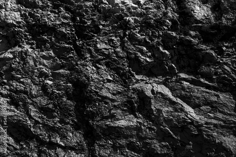 Grungy cragged bumpy pitted cavity stone facade, split layer gap.Ruined ...