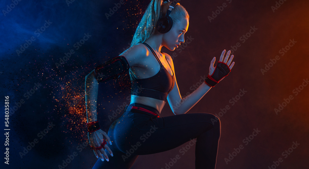 Sprinter run. Strong athletic woman running on black background wearing ...