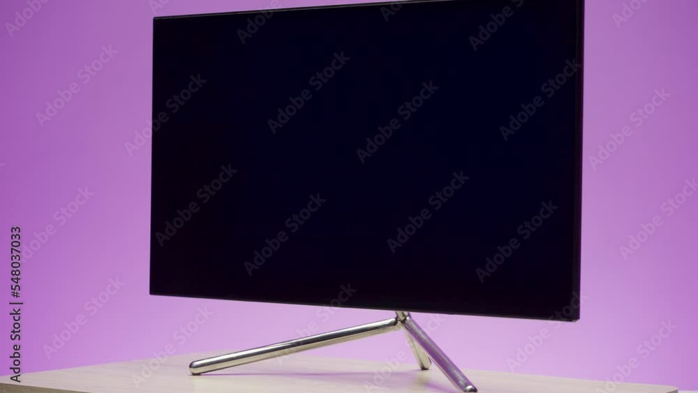 Large plasma TV. Action. A blue background with a changing color with a ...