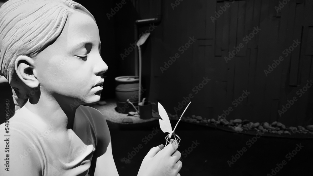 Fotografia do Stock: Grayscale of a kid holding a butterfly made with ...
