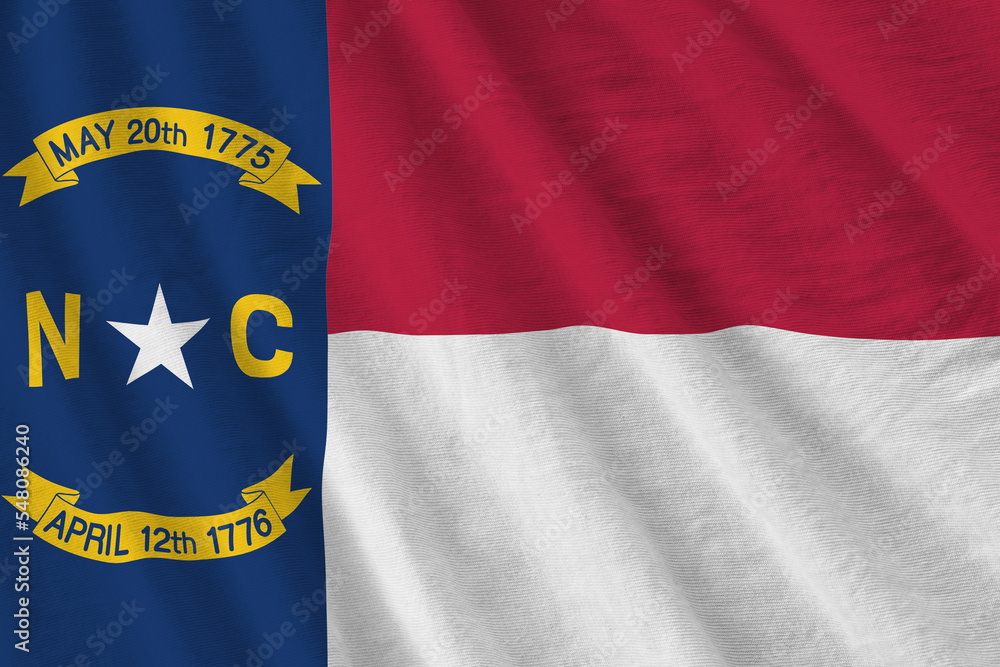 North Carolina US state flag with big folds waving close up under the ...