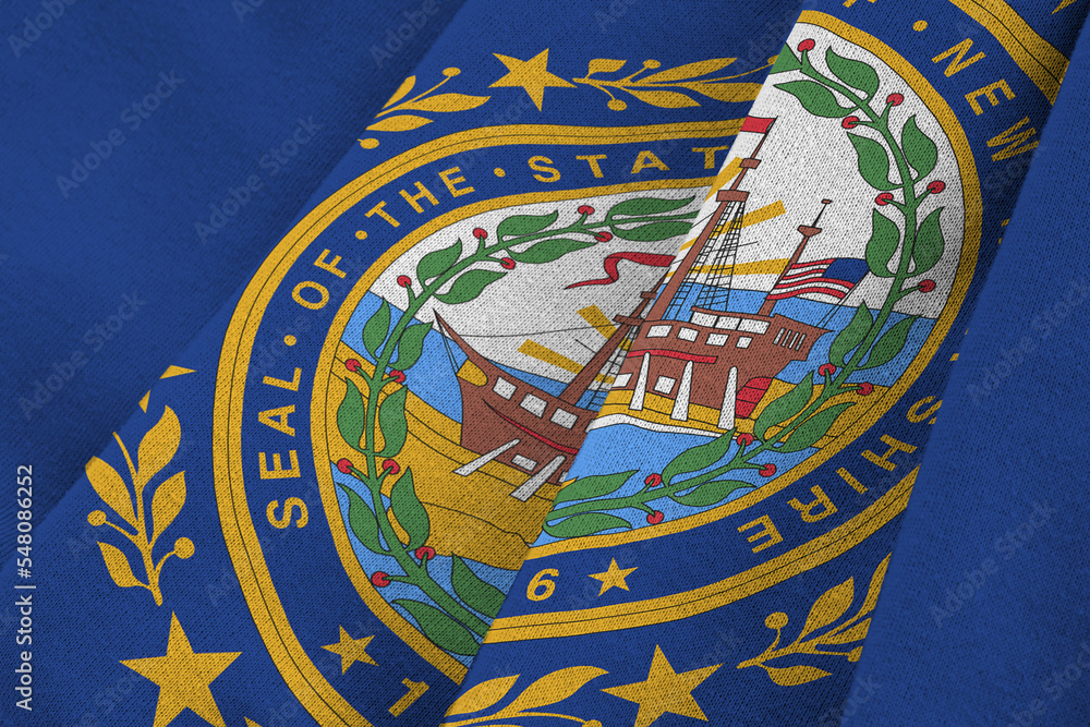 New Hampshire US state flag with big folds waving close up under the ...