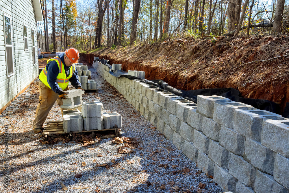 Contractor was seen installing concrete block wall that is being built ...