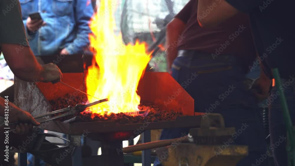 Horse shoe making in progress, professional blacksmith using forged ...
