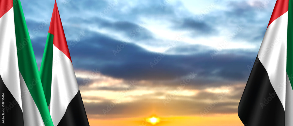 UAE flags on background of sunset or sunrise. Concept for National ...