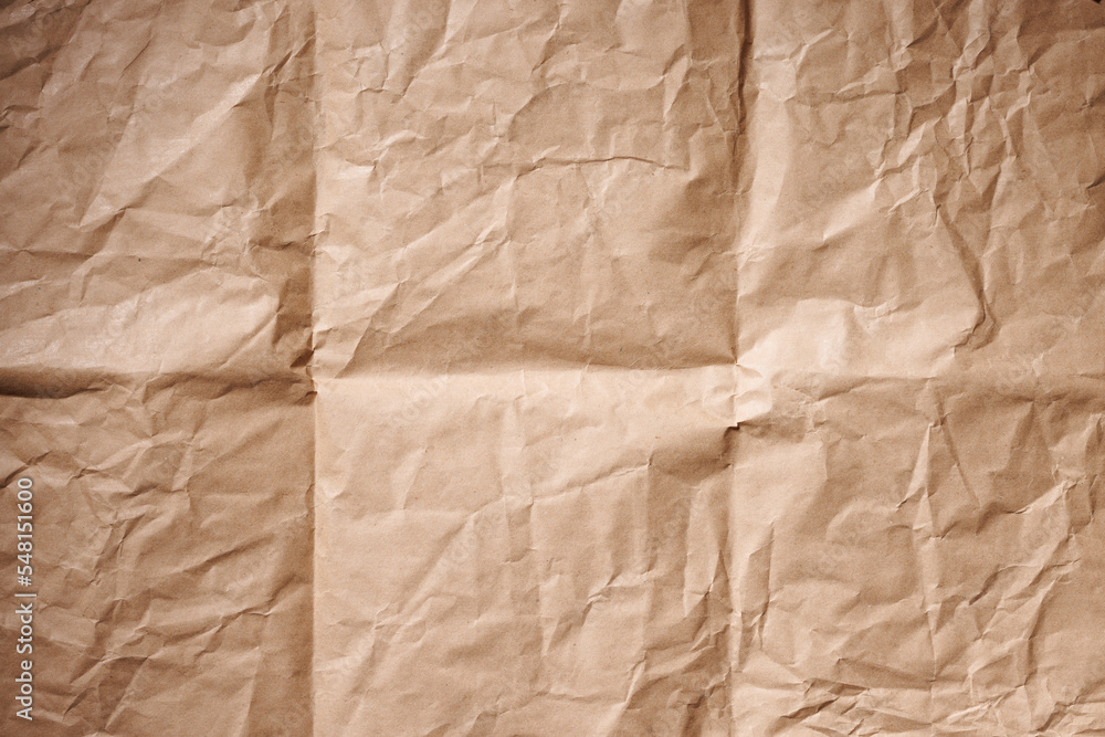 Crumpled brown kraft paper with folded folds. Background texture. Stock ...