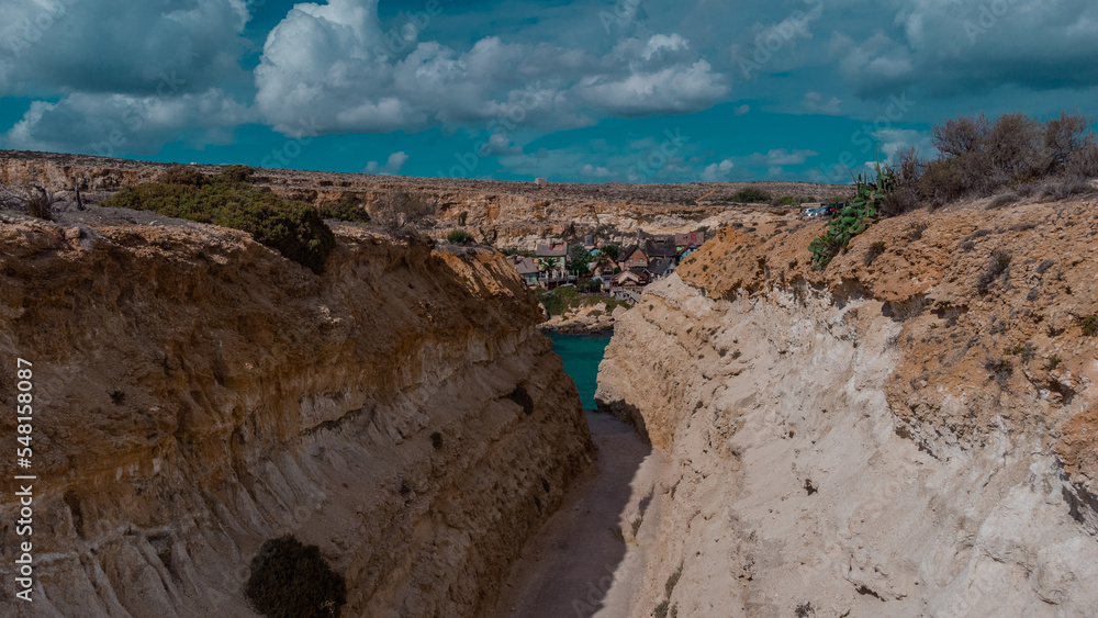 Narrow man made gorge towards the sea used to transport ships and other ...