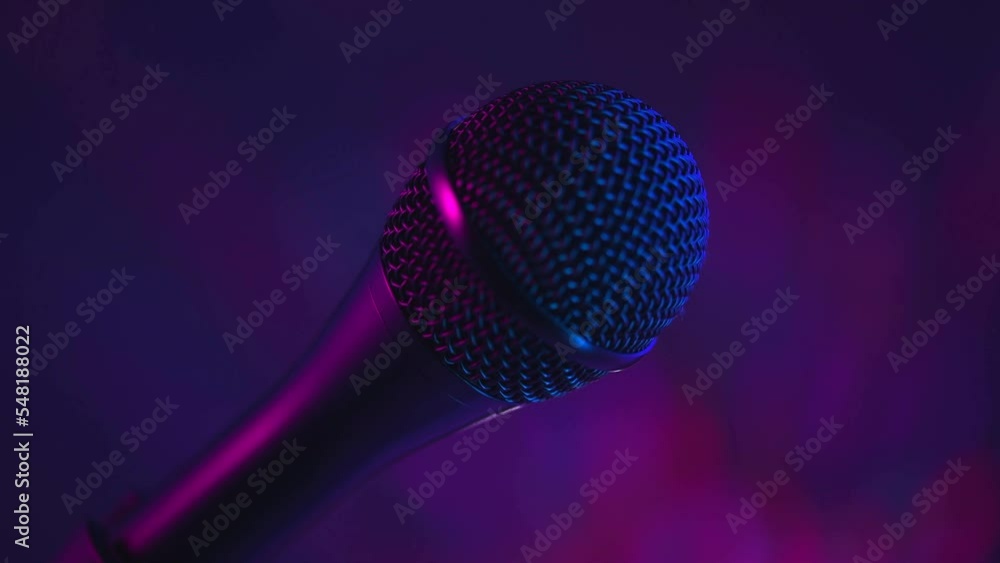 Microphone on stage close-up. Mic rotating. Karaoke, night club, bar ...