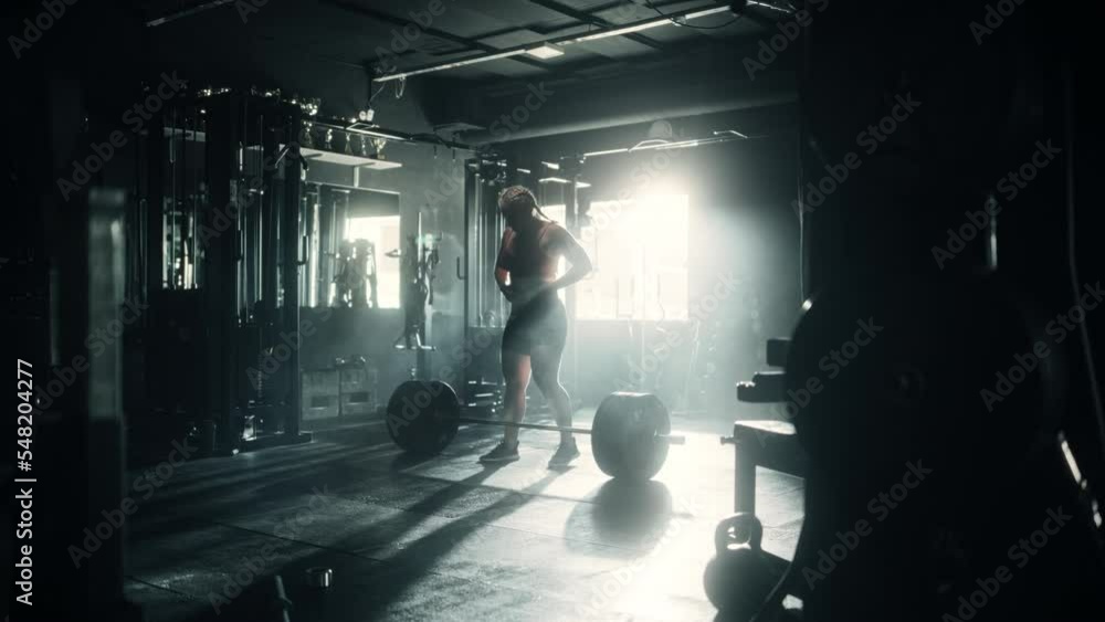 Professional Female Powerlifter Lifting Heavy Weights and Dropping Them ...