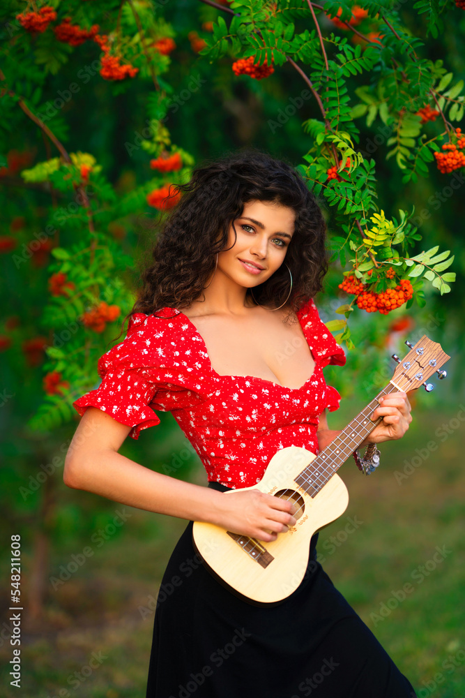 Pretty Brunette Curly Girl In Red Gipsy Costume And Accessories Posing On Nature With Rowanberry