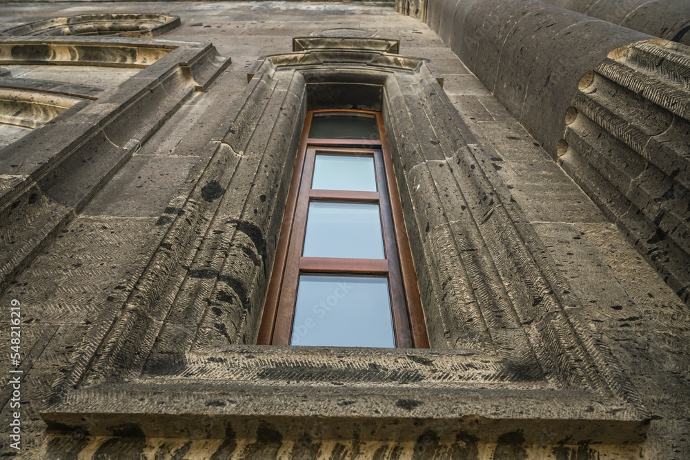 old and ancient wooden window frames and stone wall facade. Stone wall ...