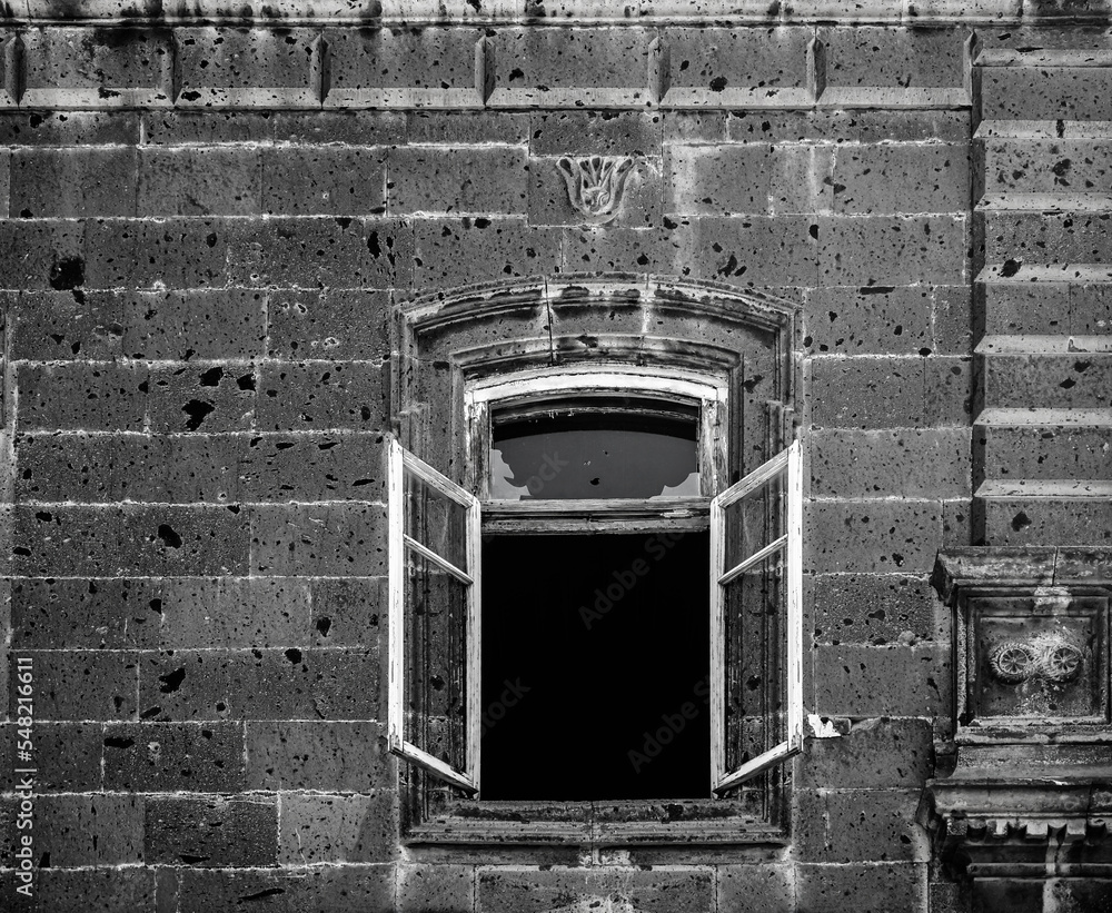 old and ancient wooden window frames and stone wall facade. Stone wall ...