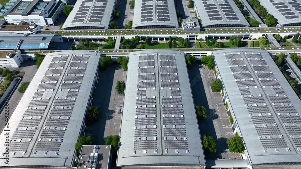Rooftop of industrial building with solar cells on it. New industrial ...