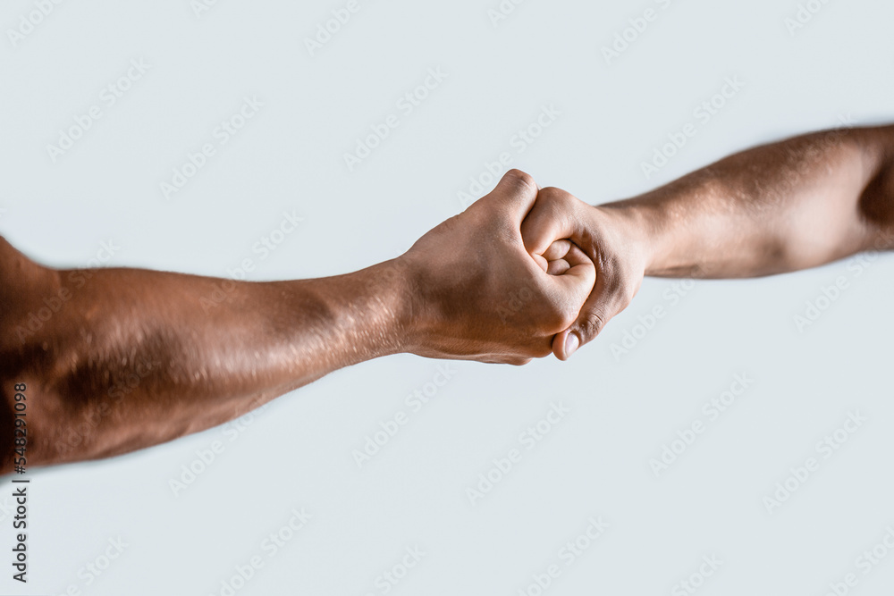 Friendly handshake, friends greeting, teamwork, friendship. Close-up ...