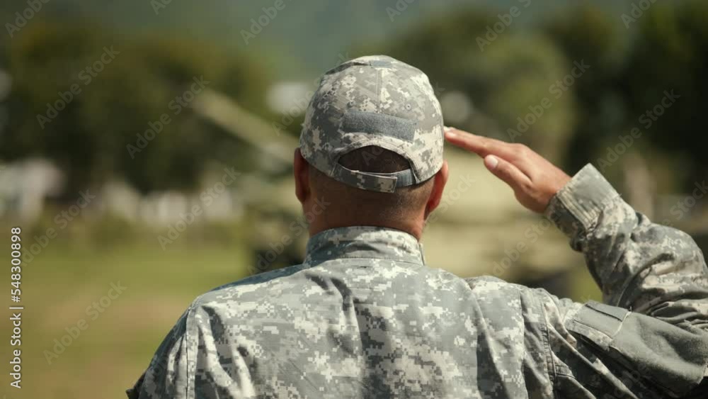 Soldier man in military uniform special forces saluting standing ...