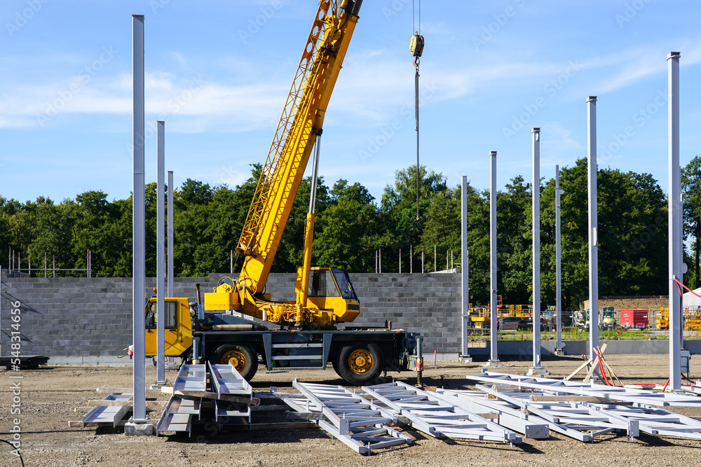 Construction site of a new industrial building with vertical steel ...