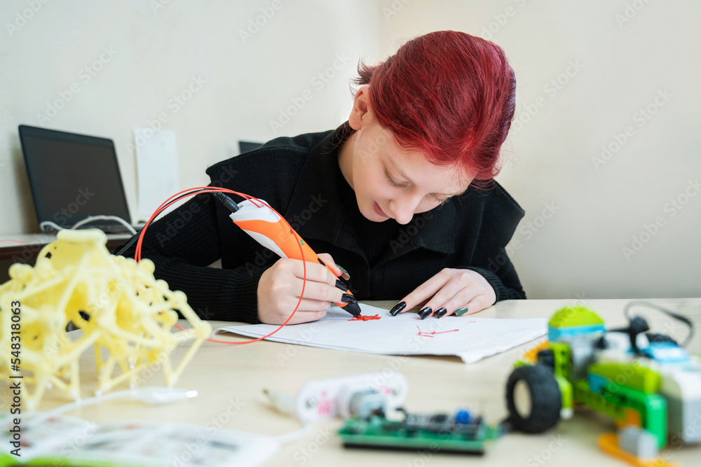 Teenager girl creating with 3d printing pen new object. STEM education ...