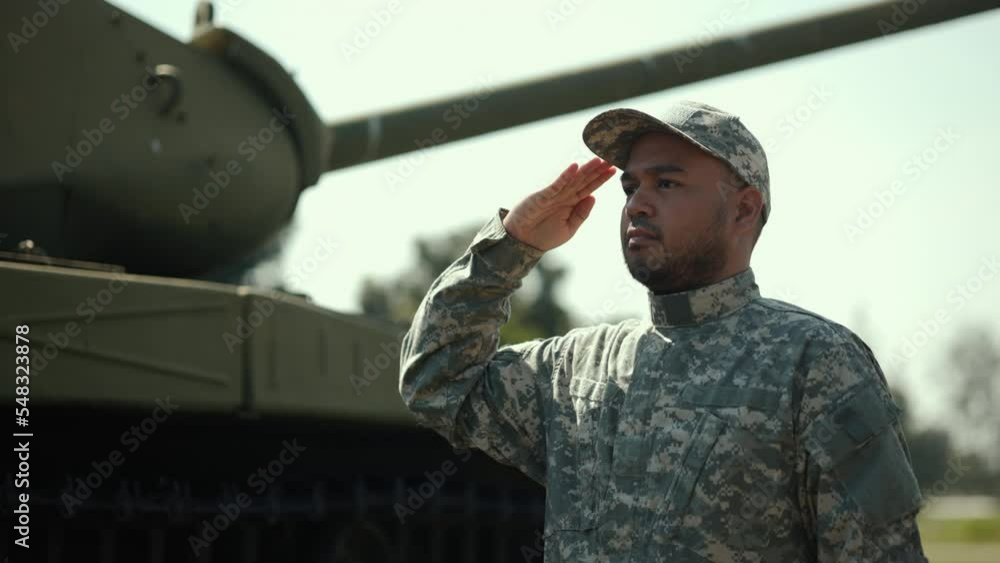 Soldier man in military uniform special forces saluting standing ...