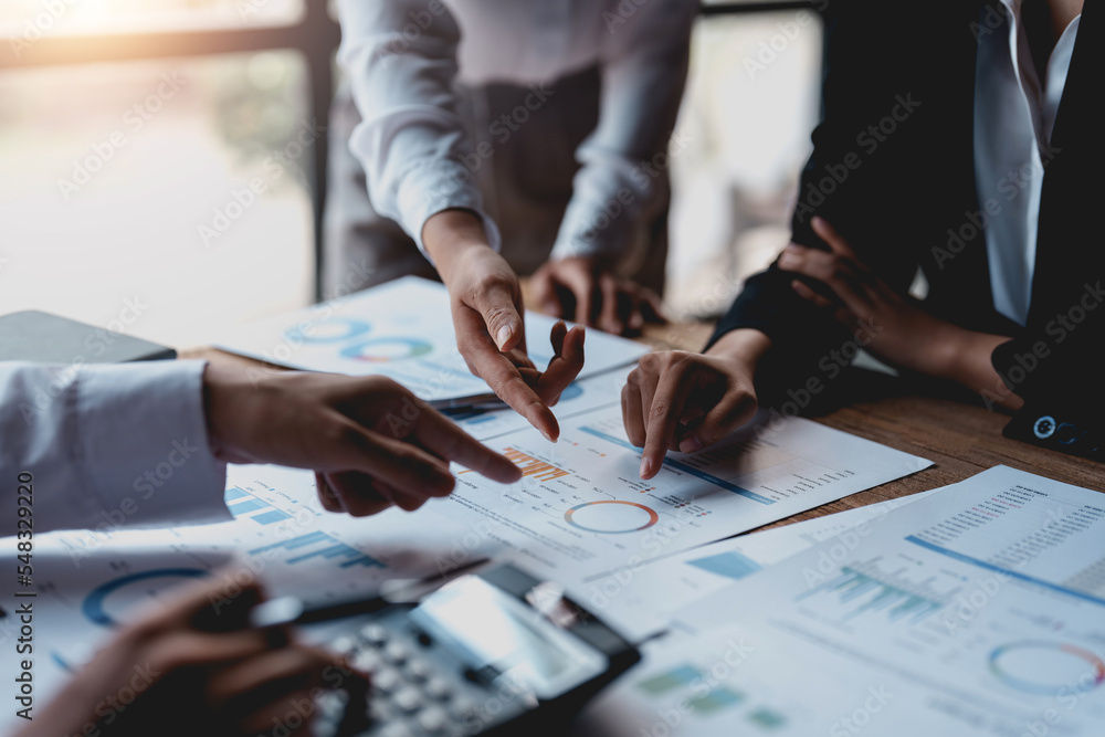 Image of a group of business people meeting using a tablet and ...