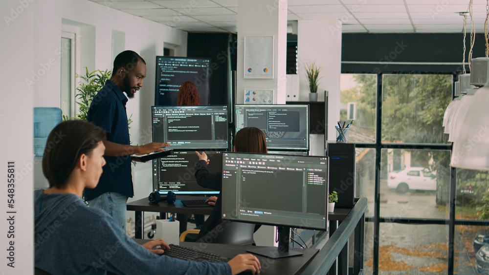 Diverse Team Of Database Developers Analyzing Code On Terminal Window Working With Html Script