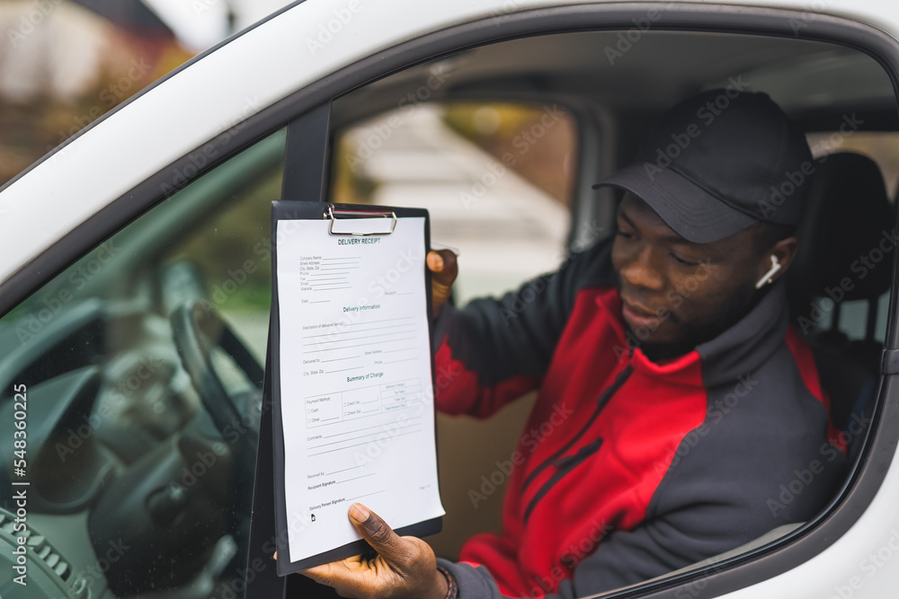 Documents printed on white paper. Professional Black courier man in red ...
