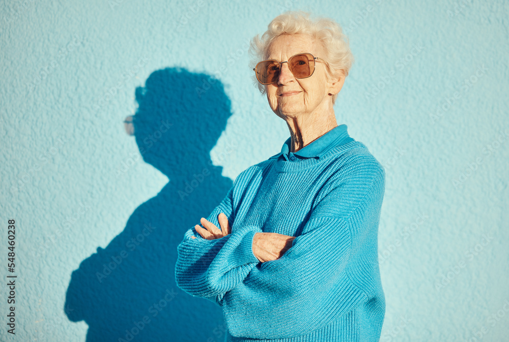 Fashion, sunglasses and portrait of old woman with arms crossed on wall ...