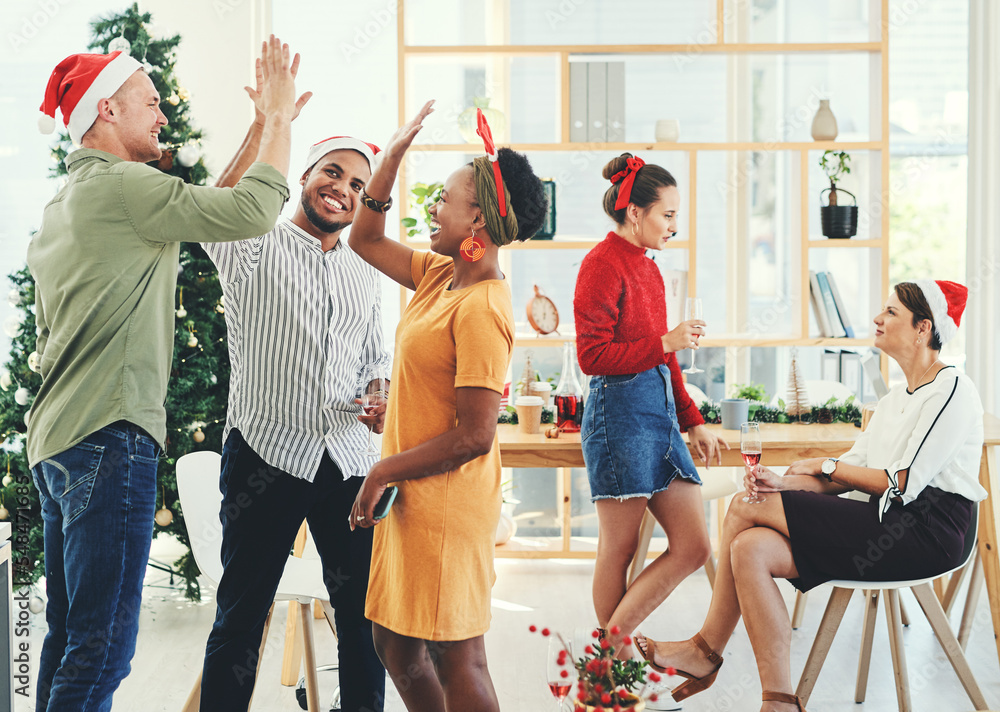 Christmas, party and high five with business people having fun in their ...