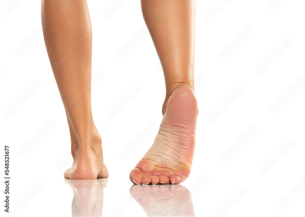 Pretty woman legs and sole feet on white background Stock Photo | Adobe ...