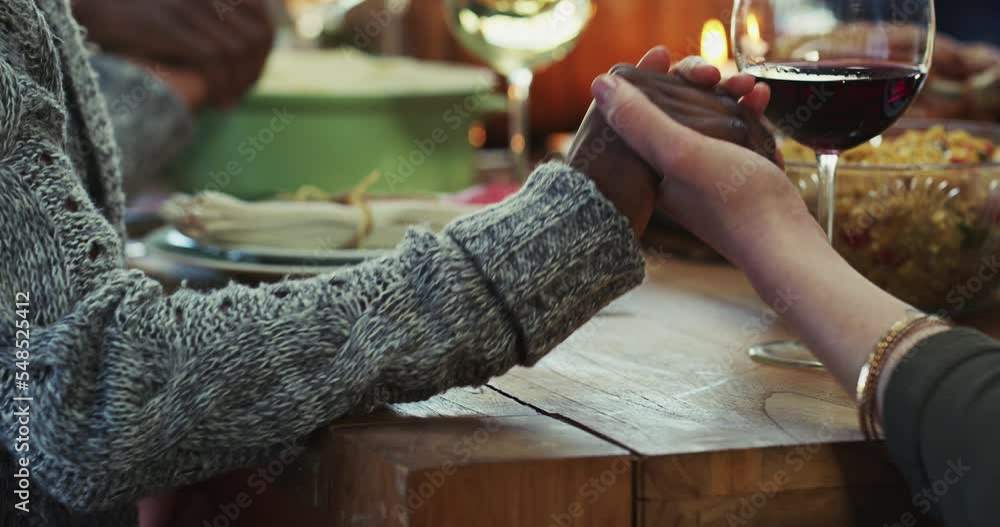 Friends, family and prayer at dinner, holding hands and table together ...