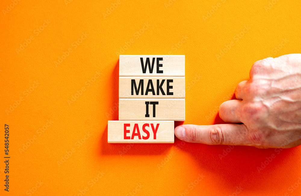 We make it easy symbol. Concept words We make it easy on wooden cubes ...