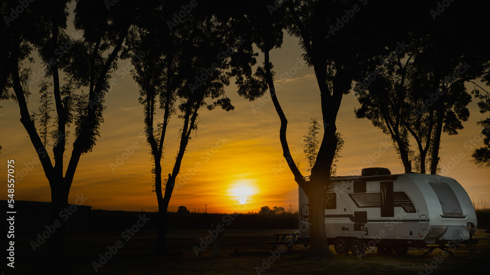 Camping at campsite with beautiful sky sunrise/sunset and trees in ...