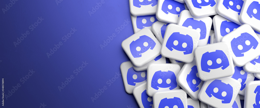 Logos of Discord the voice, video, and text chat app on a heap on a ...