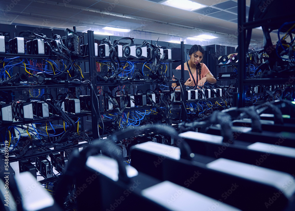 Female technician working in server room Stock Photo | Adobe Stock