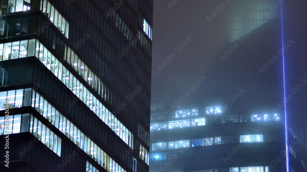 Modern office building in city at the night. View on illuminated ...