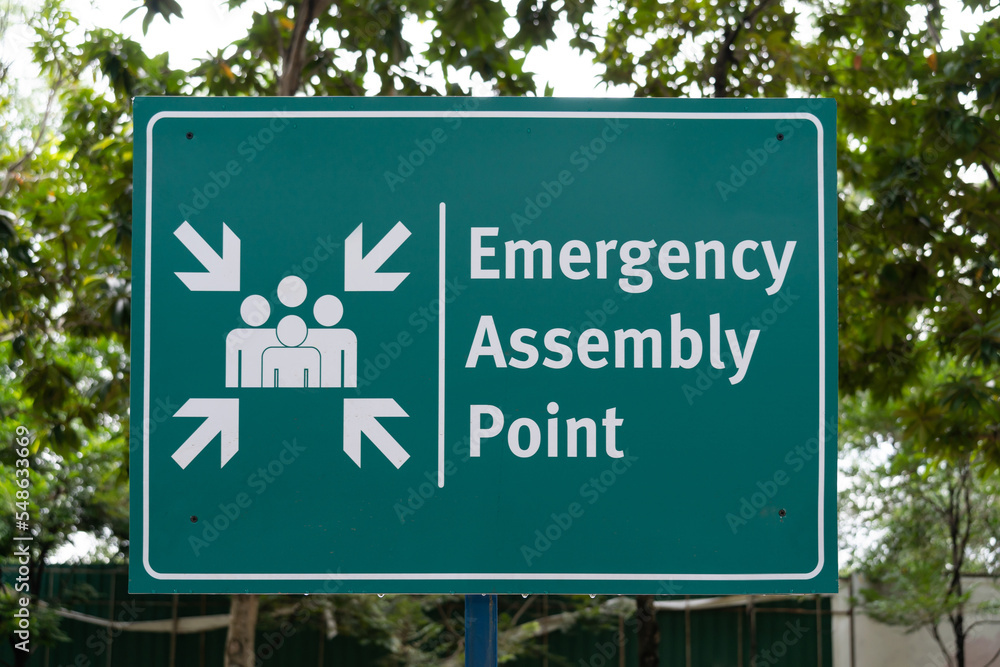 Emergency assembly point sign in the park. Stock Photo | Adobe Stock