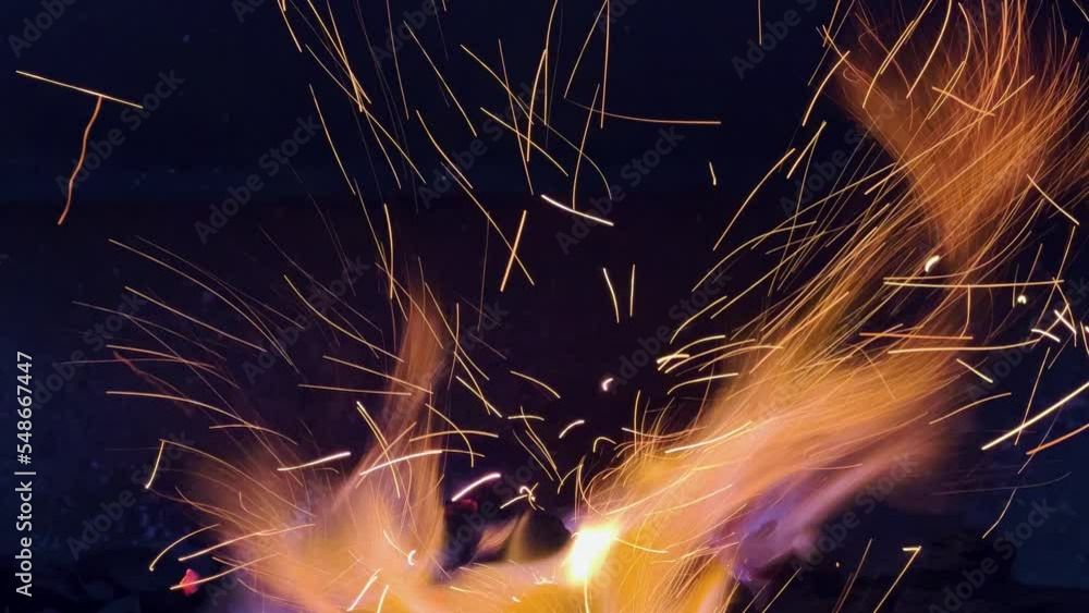 Glowing fire tongues. Close-up on sparkling firewood flames. Happy ...