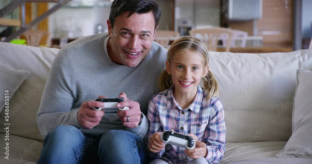 Children, video games and family with a father and daughter playing or ...