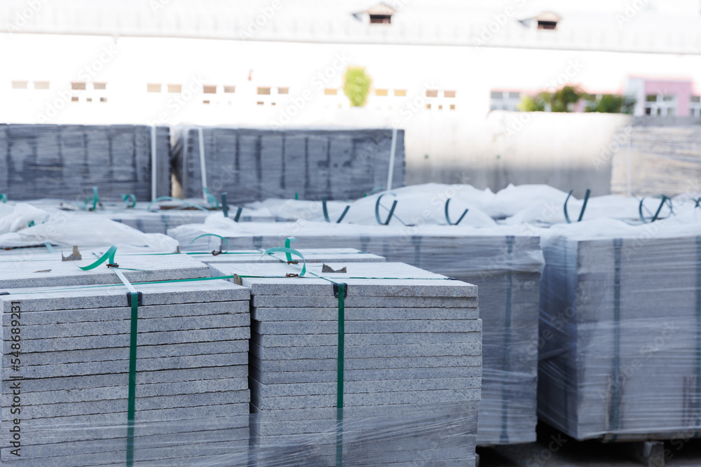 Paving tiles for paving sidewalks. Pallets and packages of fresh ...