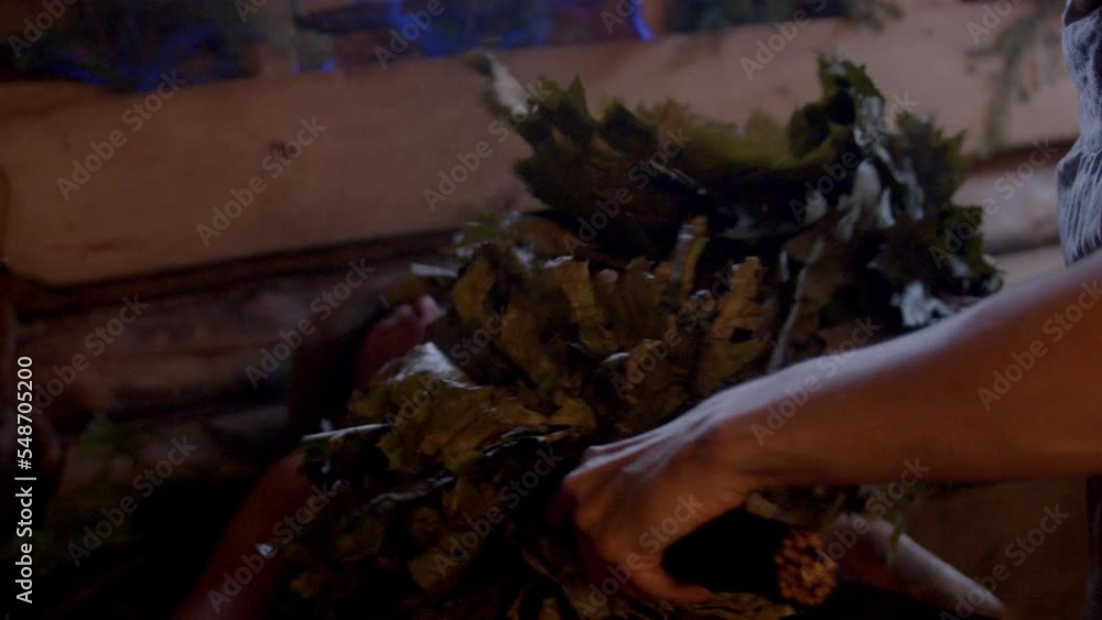 Ukrainian national bath. Woman and her boyfriend steaming in bathhouse ...