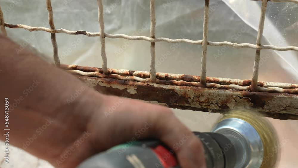 Video Stock Electric grinder with round metal brush nozzle rotating at ...