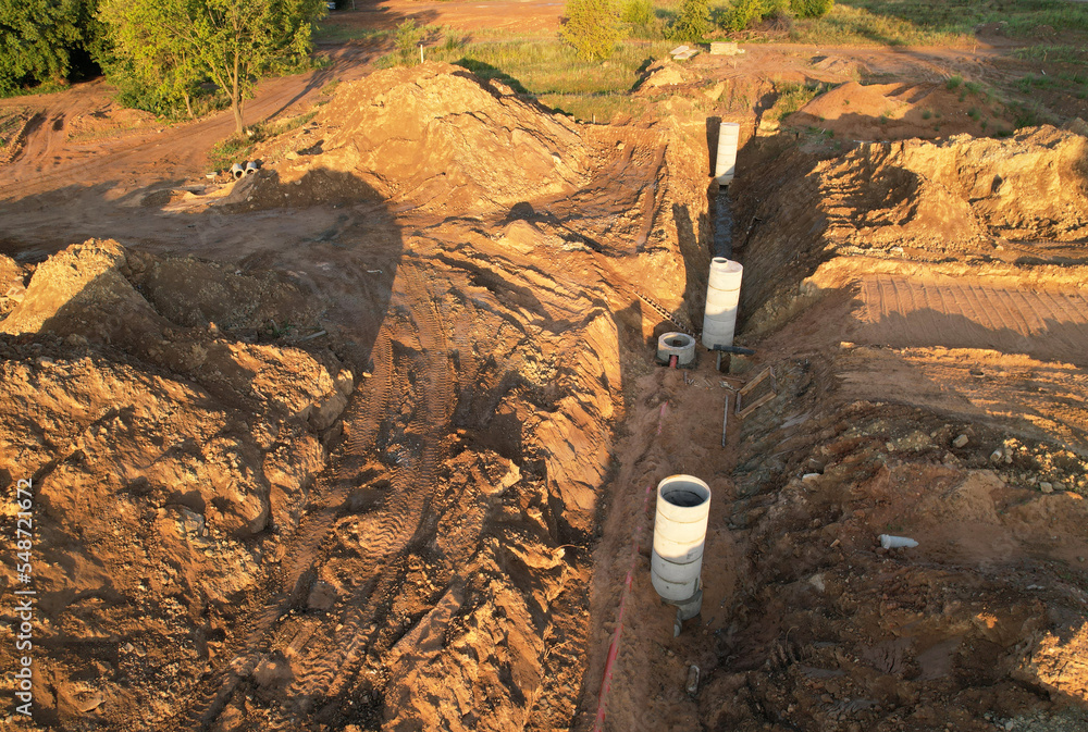 Laying of underground storm sewer pipes and sewerage well. Sewerge ...