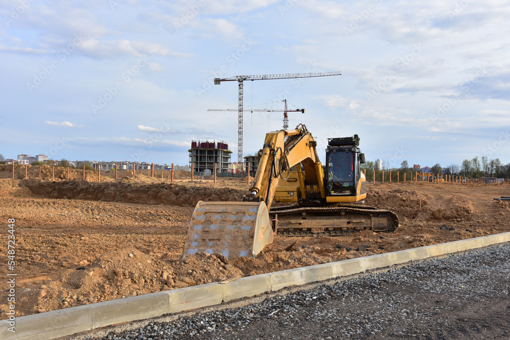 Excavator dig ground at construction site. Dig foundation. Construction ...