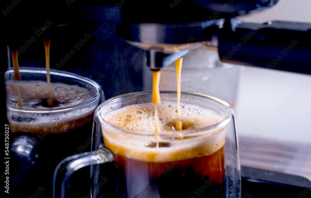 close-up of Coffee foam. espresso crema comes out of the fully ...