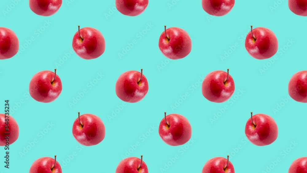 Red apples in geometric grid in seamless loop pattern on a light blue ...