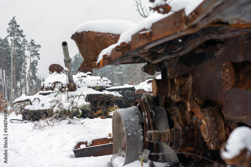 Russian battle tank in the snow which was destroyed on the roadside of ...