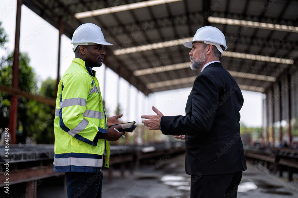 At construction site manager meet engineer check precast concrete slabs ...