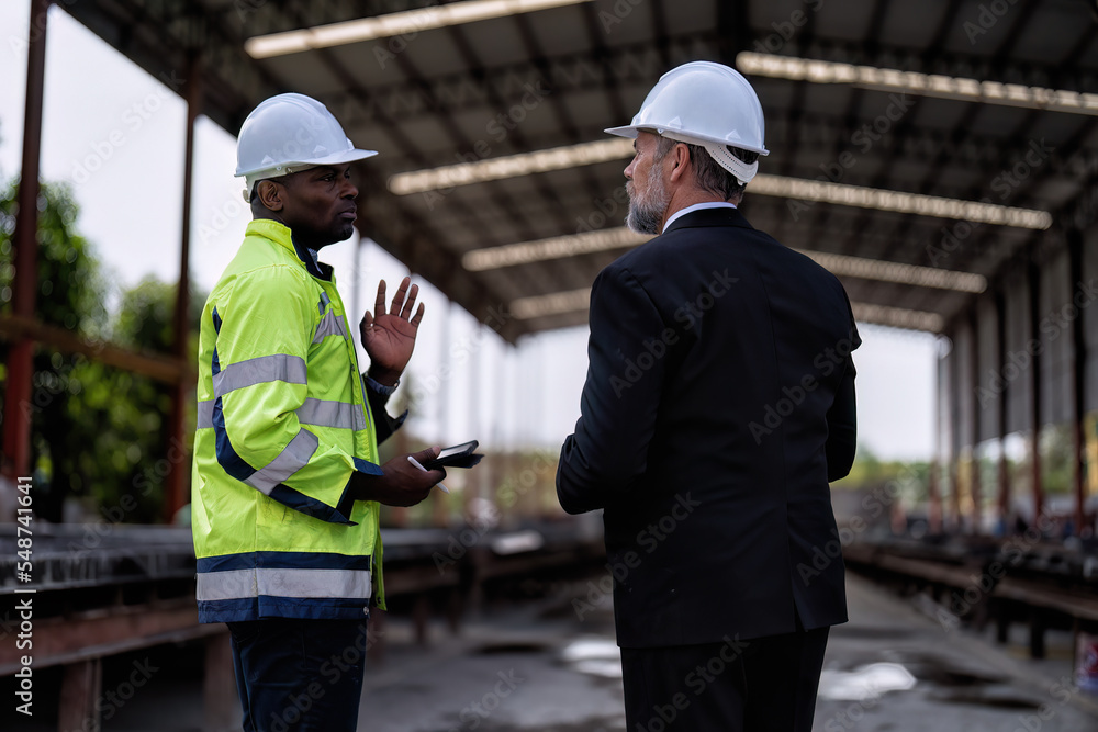 At construction site manager meet engineer check precast concrete slabs ...